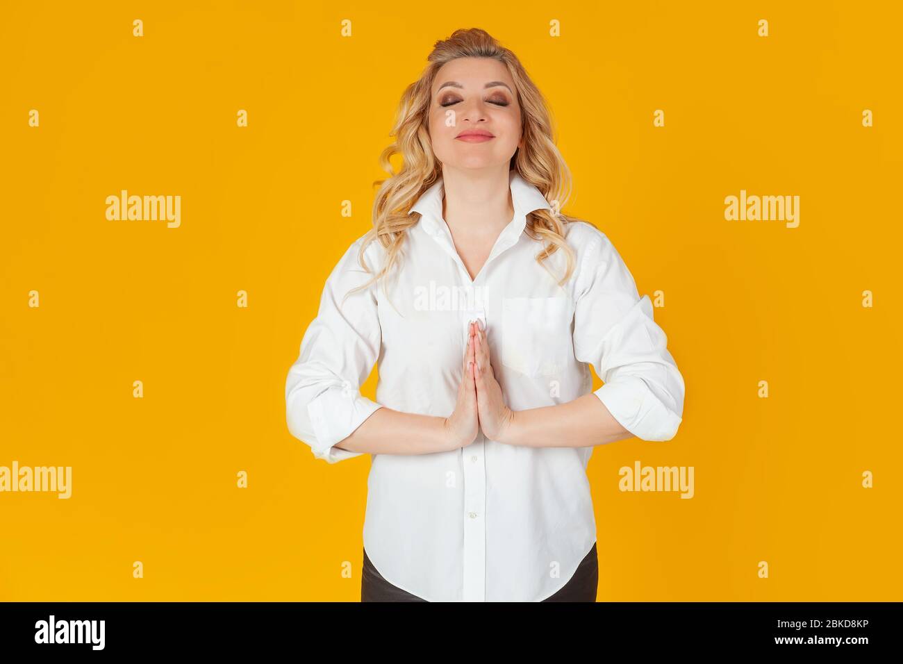 One woman hands prayer chest hi-res stock photography and images - Alamy