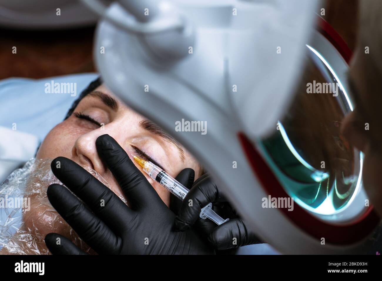 Beautician makes an injection of beauty. The doctor injects an ...