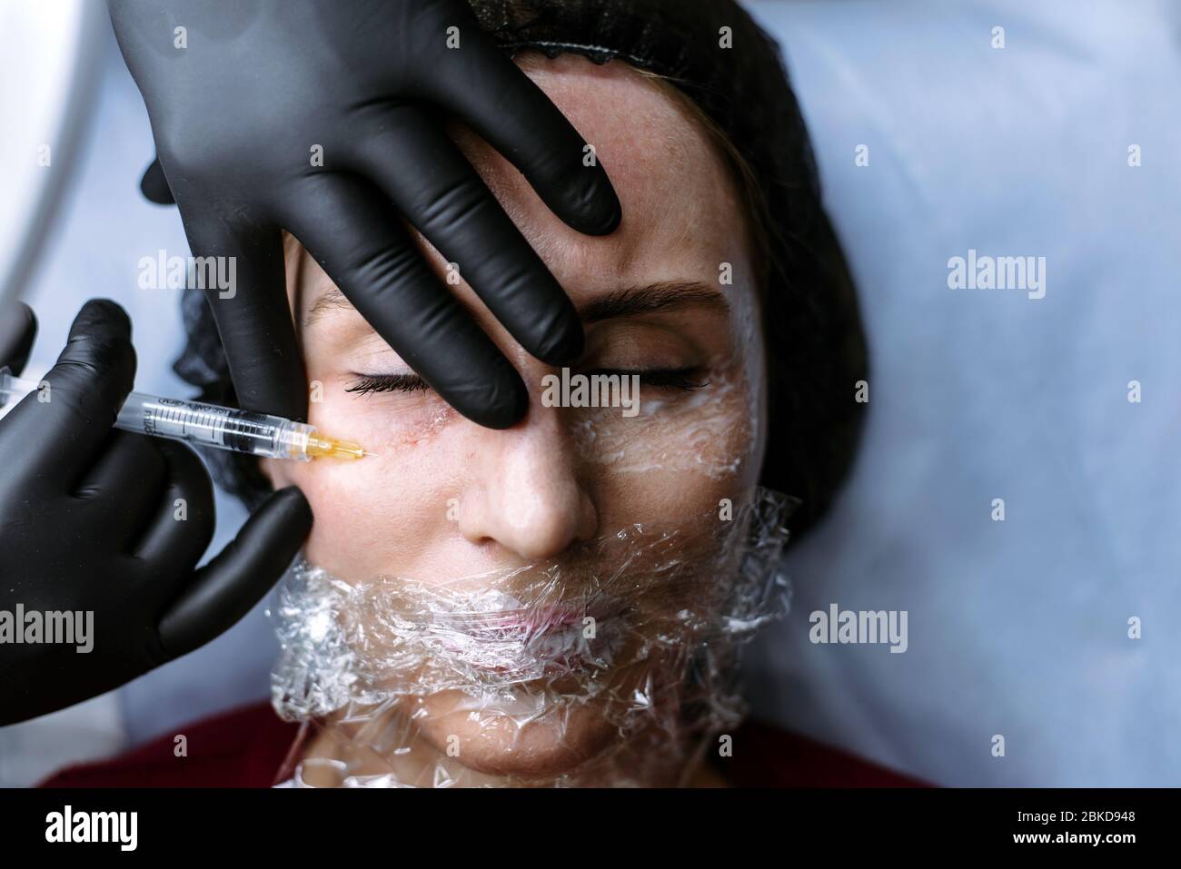 Beautician makes an injection of beauty. The doctor injects an ...