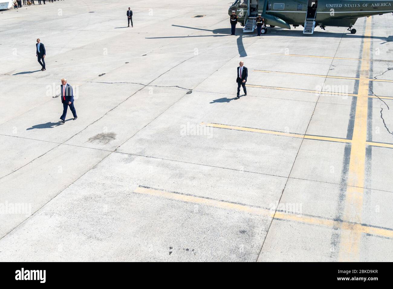 President Donald J. Trump walks across the tarmac at New York’s JFK ...