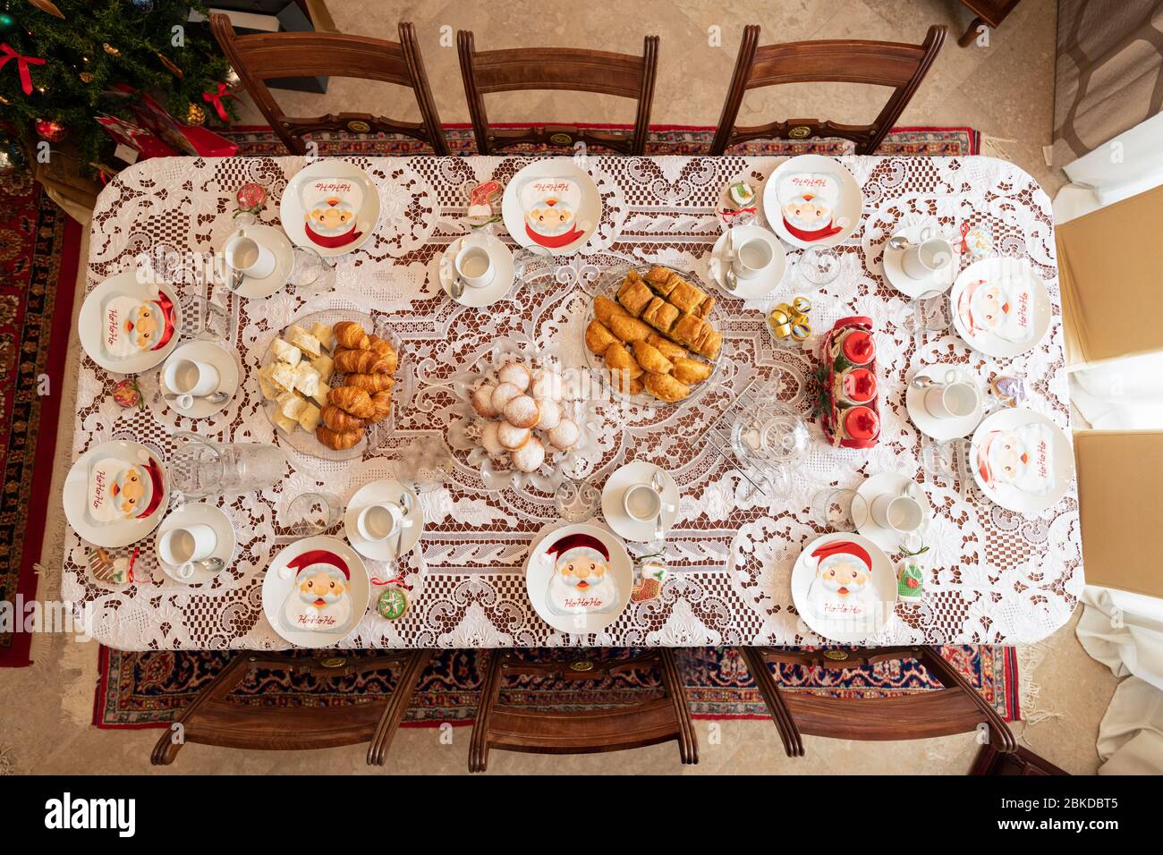 Top view for a Christmas table decoration with donuts and other finger ...