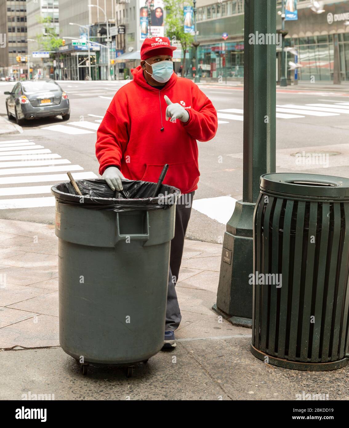 New York, NY - May 3, 2020: Janitor wearing facial mask cleans Third ...