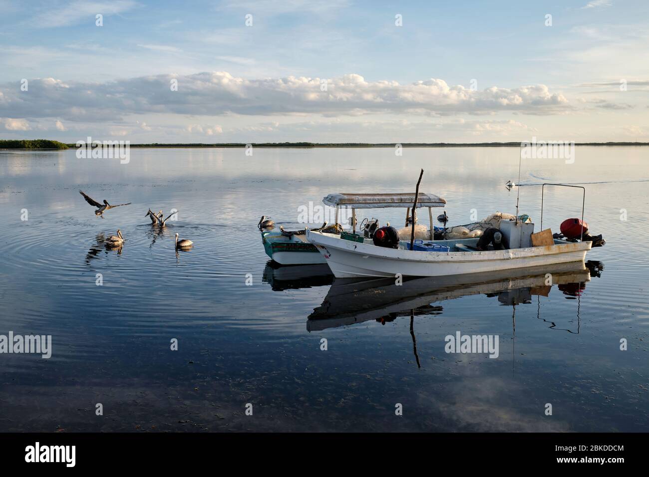 Fishermen preparing their boats and fishing gear to go fishing at ...