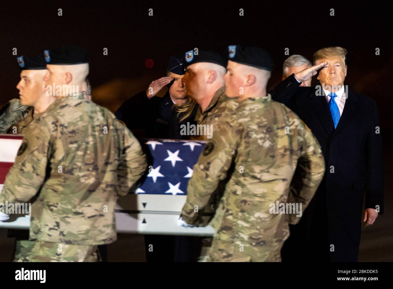 President Donald J. Trump salutes during the dignified transfer ...