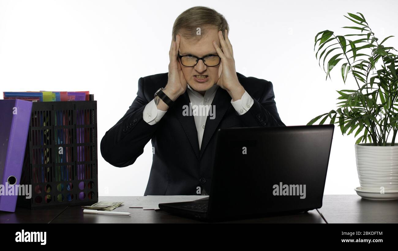 Shocked stressful businessman executive finds failure mistake in his ...