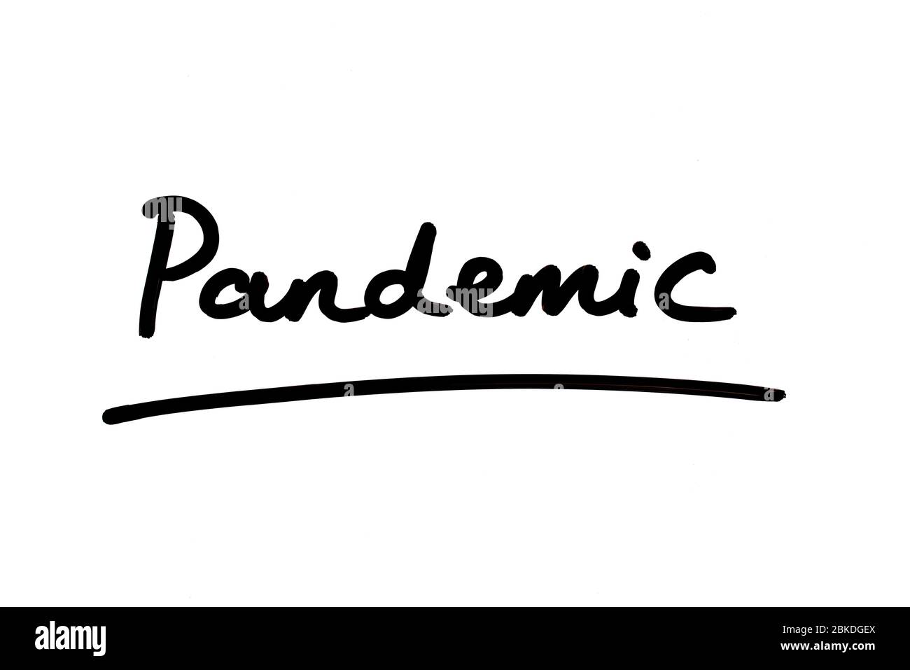 Pandemic handwritten on a white background Stock Photo - Alamy