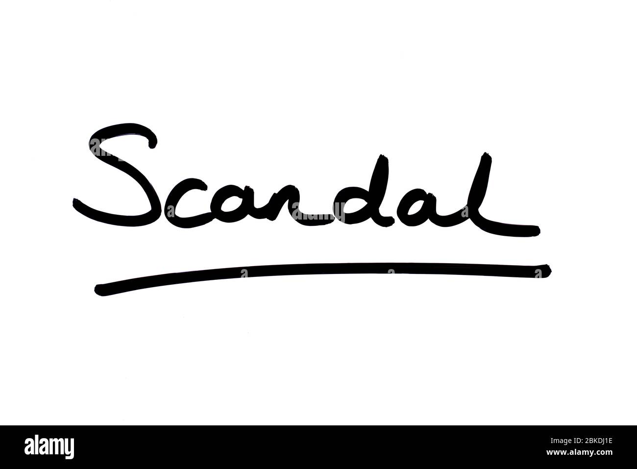 Scandal handwritten on a white background Stock Photo - Alamy
