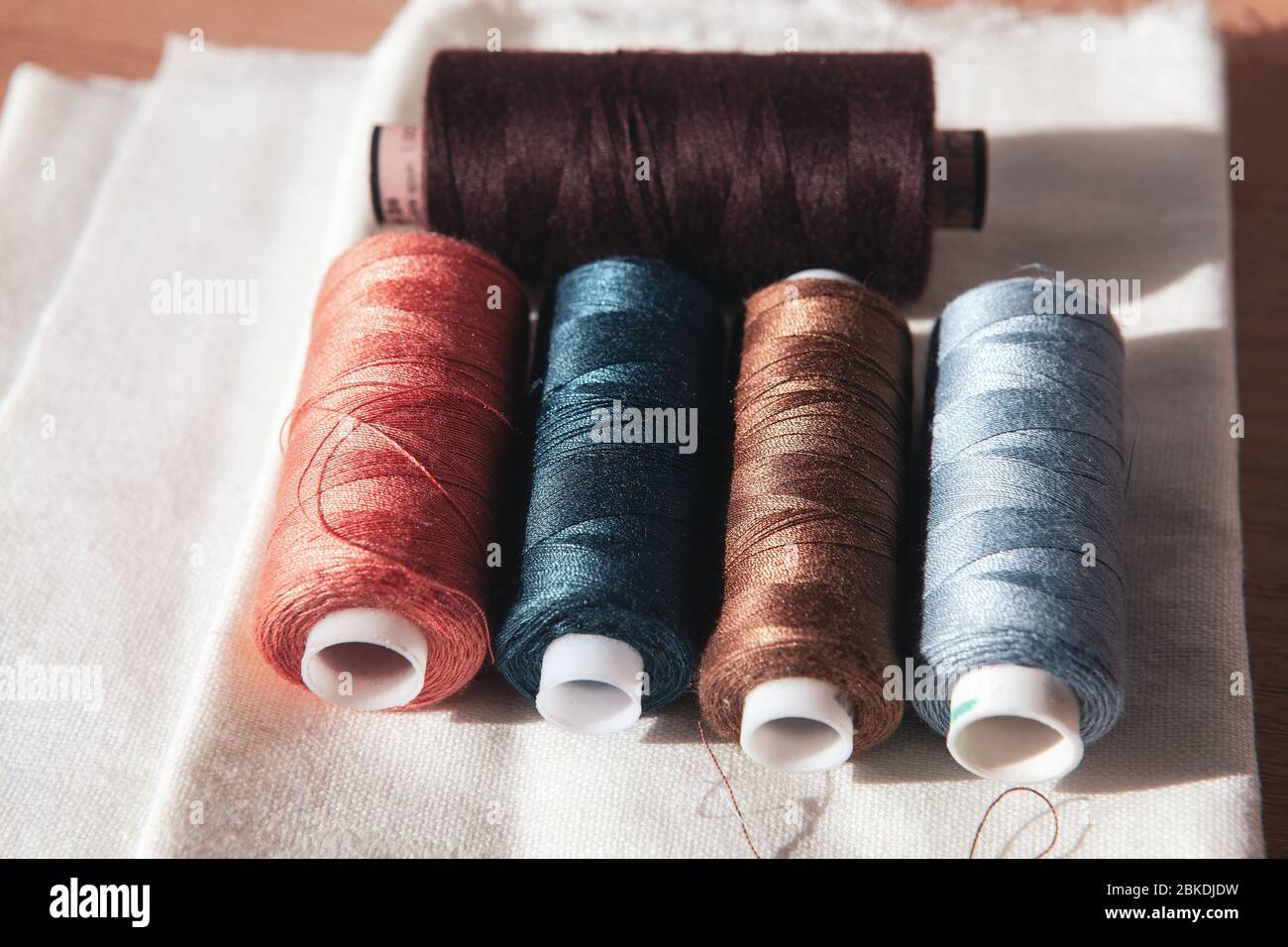 sewing spools with colored threads Stock Photo - Alamy