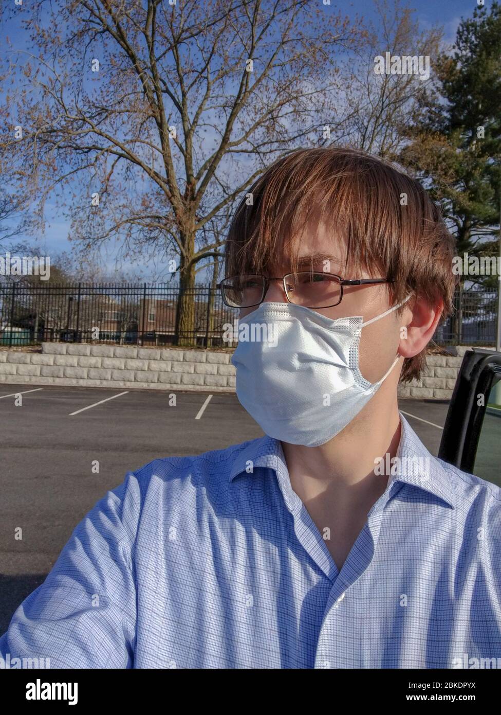 Back to Work: Professional wearing face mask arrives at work during the ...