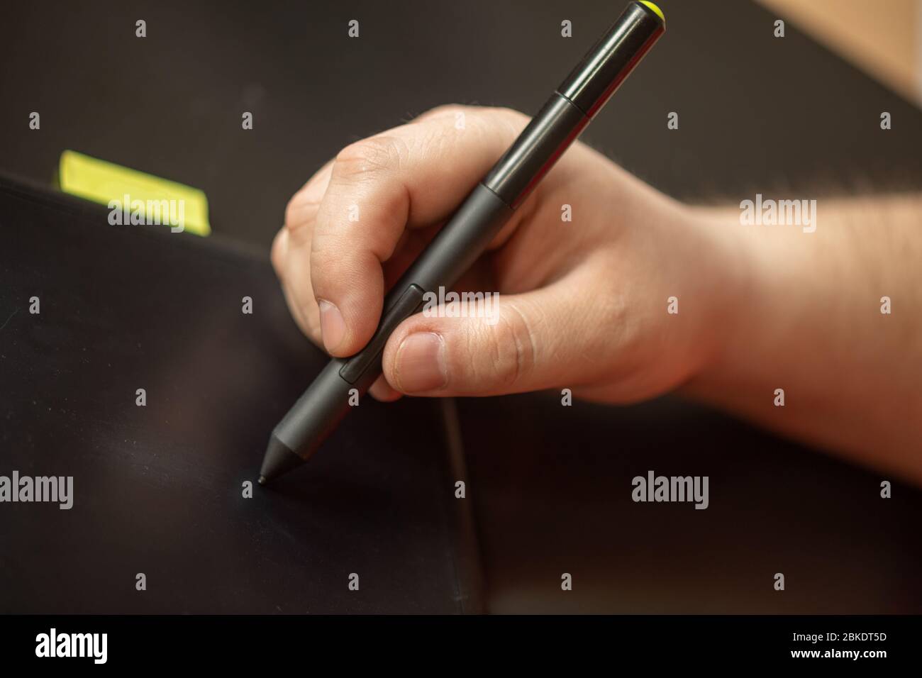 Graphic table and pen in hand of artist. Digital Drawing and ...