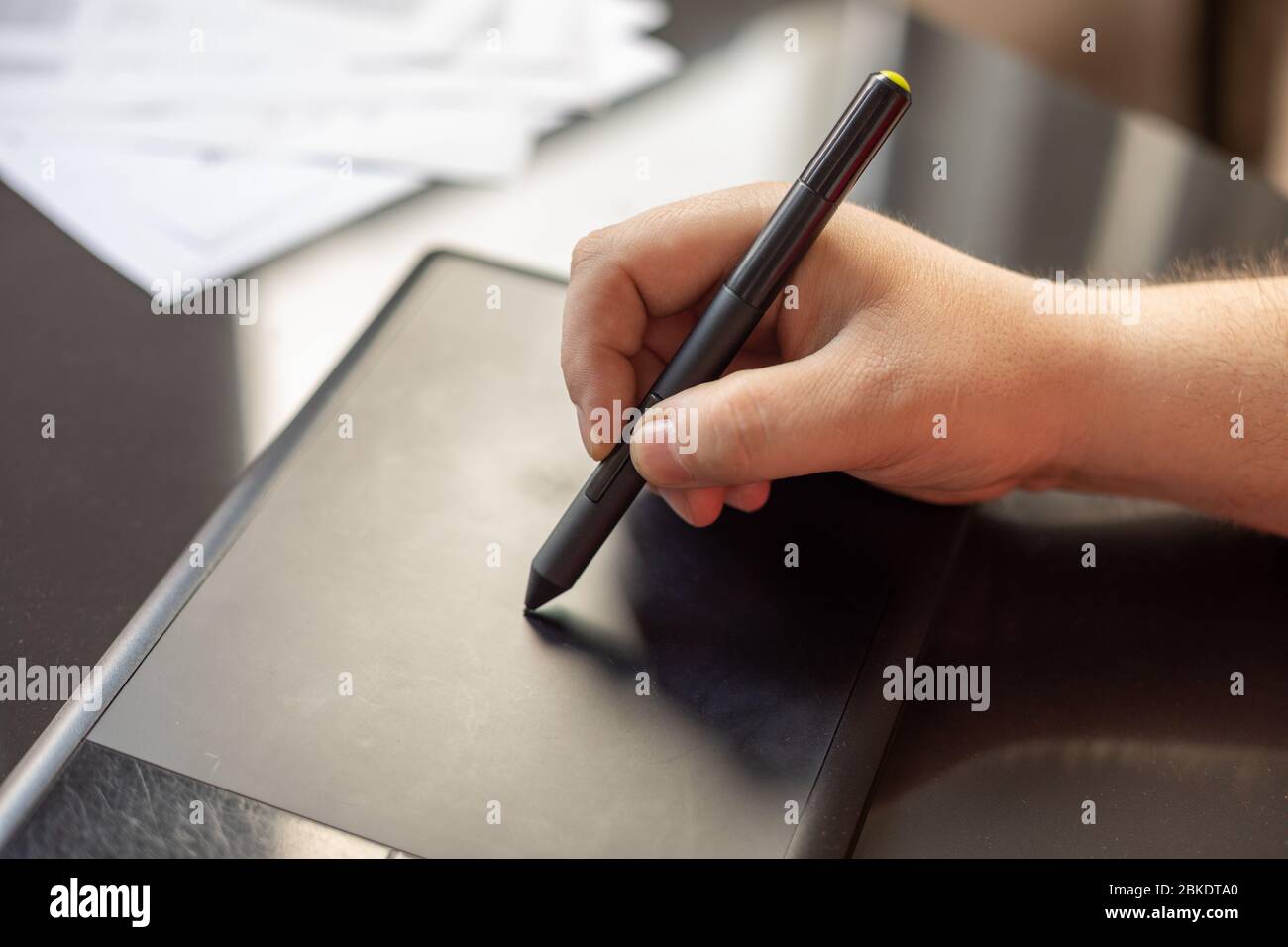 Graphic table and pen in hand of artist. Digital Drawing and ...