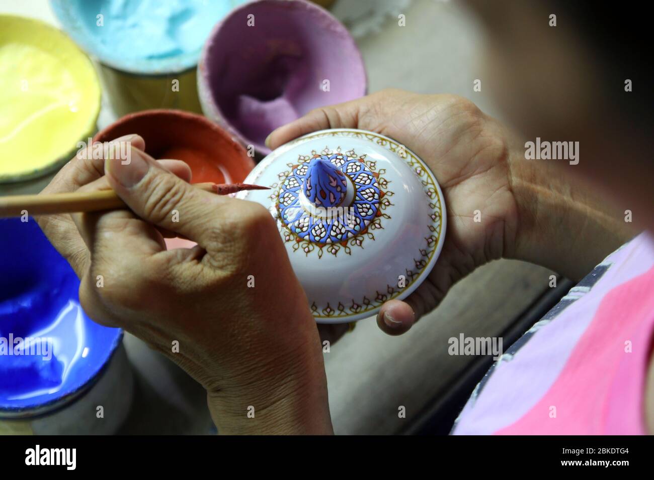 artist painting benjarong ceramic ware , A traditional Thai five ...