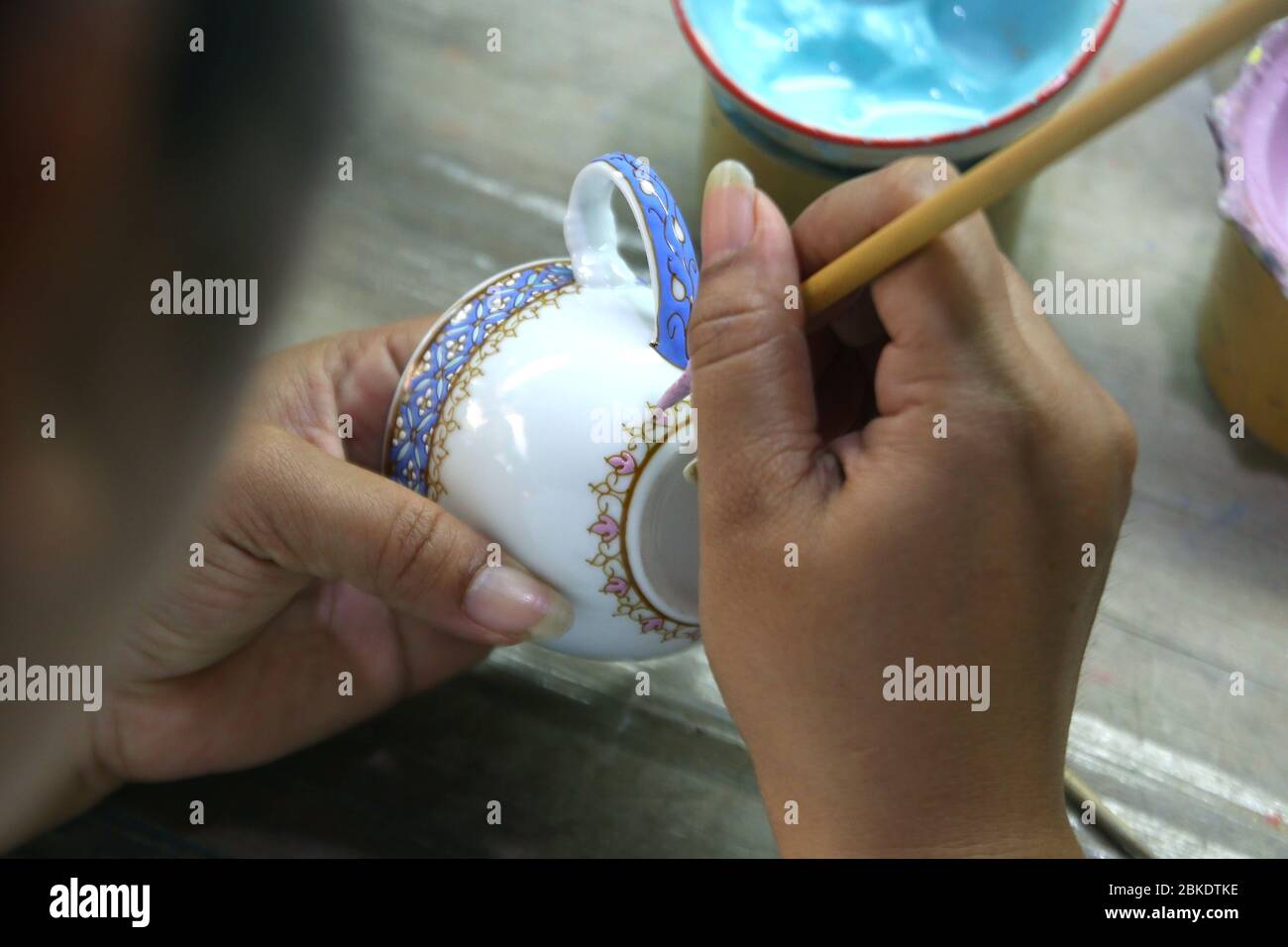 artist painting benjarong ceramic ware , A traditional Thai five ...