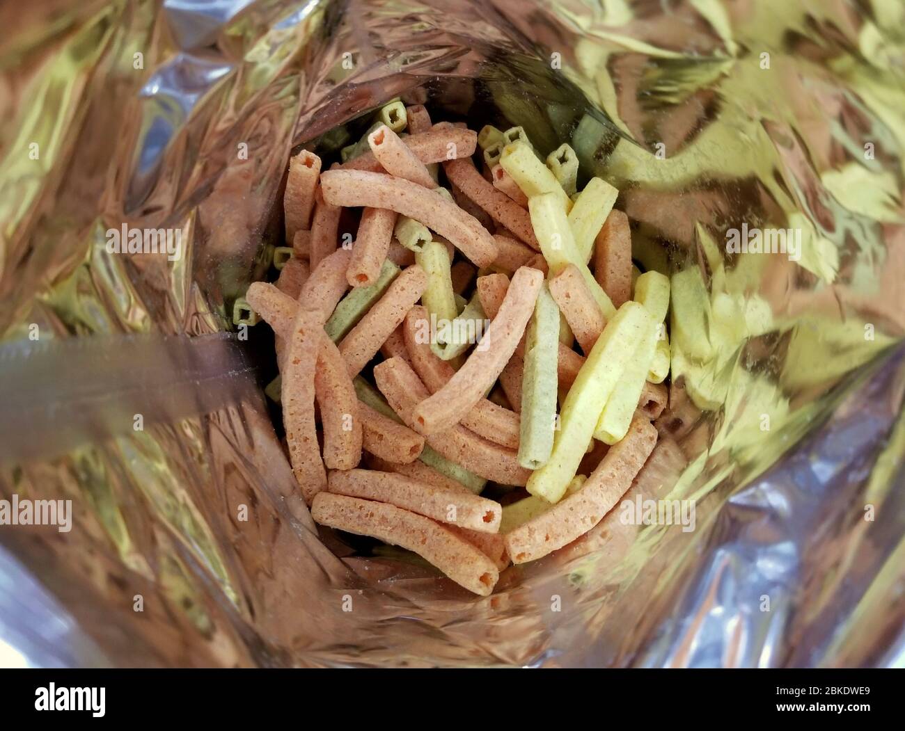 Top view of vegetable straw chips inside the snack bag Stock Photo - Alamy