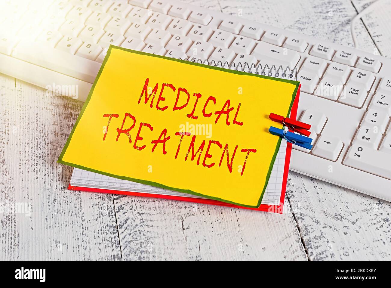 Writing note showing Medical Treatment. Business concept for Management ...