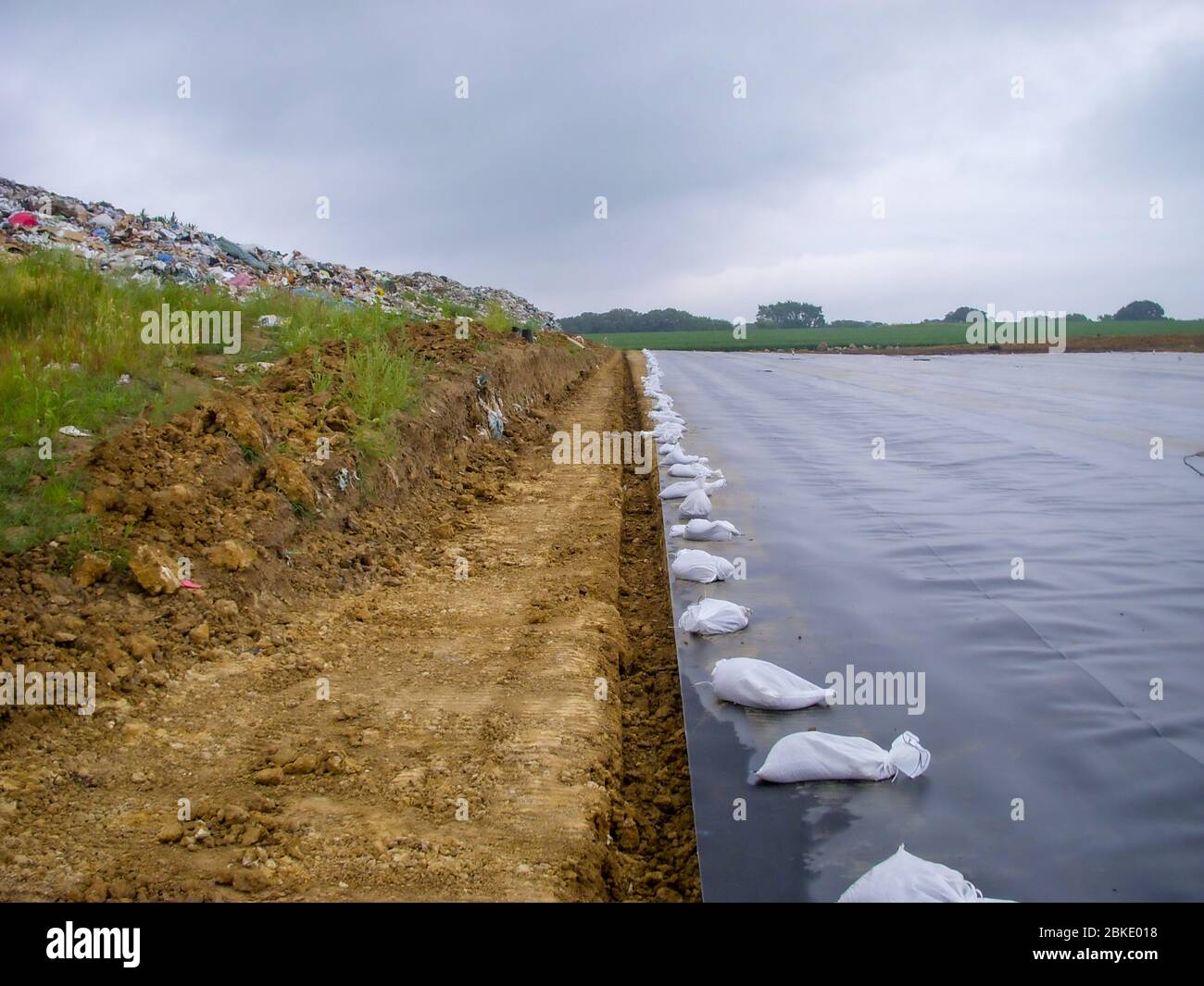 Working edge of a landfill expansion project with active landfill, clay ...
