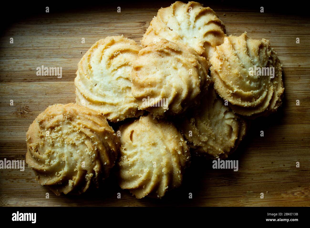 Swirl shape butter cookies in a wooden plate. Bakery cookies in swirl ...