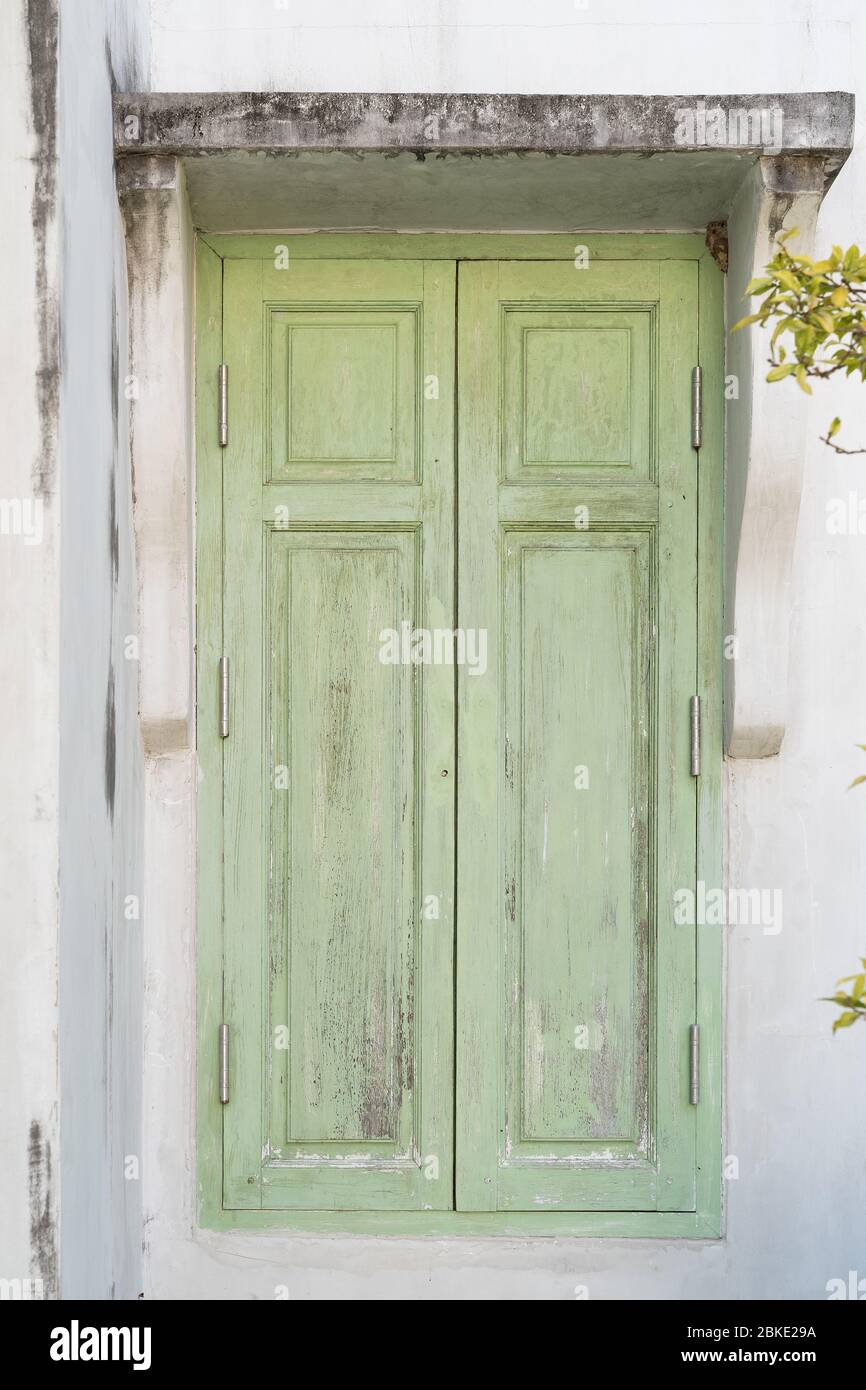 Old green window on classic house wall background. Vintage interior ...