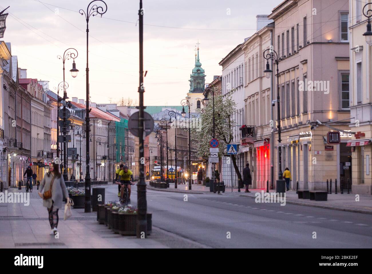 Warsaw, Poland. 20th Apr, 2020. People walk along the Krakowskie ...