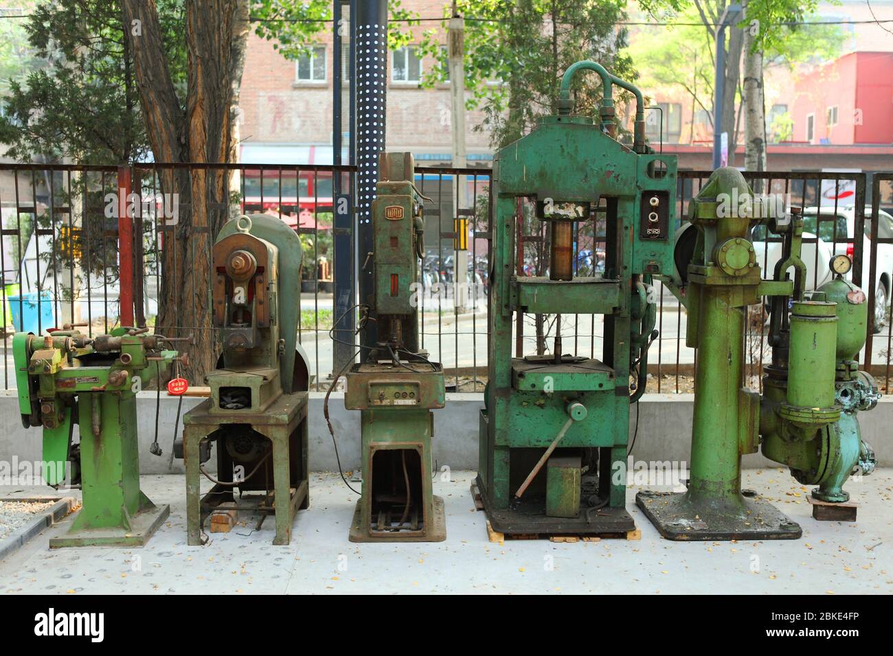 Old green colour machinery on display Stock Photo - Alamy