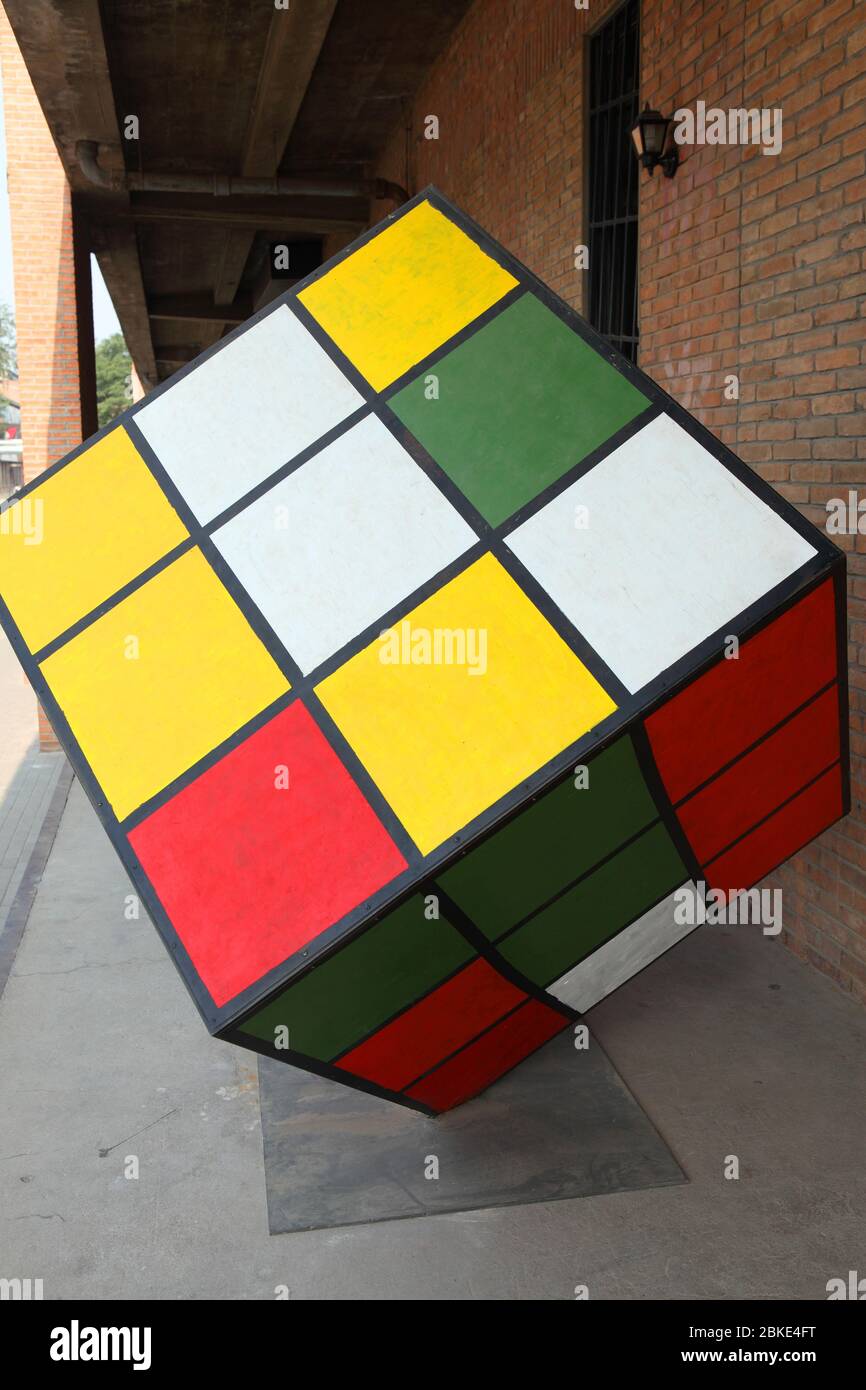Vertical view. Colourful Rubik cube in a huge size as an art display ...