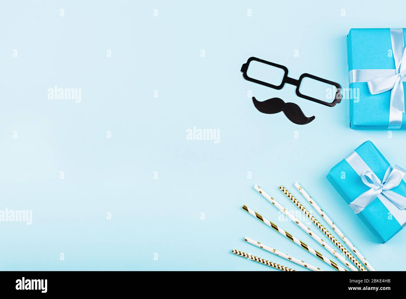 Happy Birthday or Fathers Day background with gifts and paper straws on ...