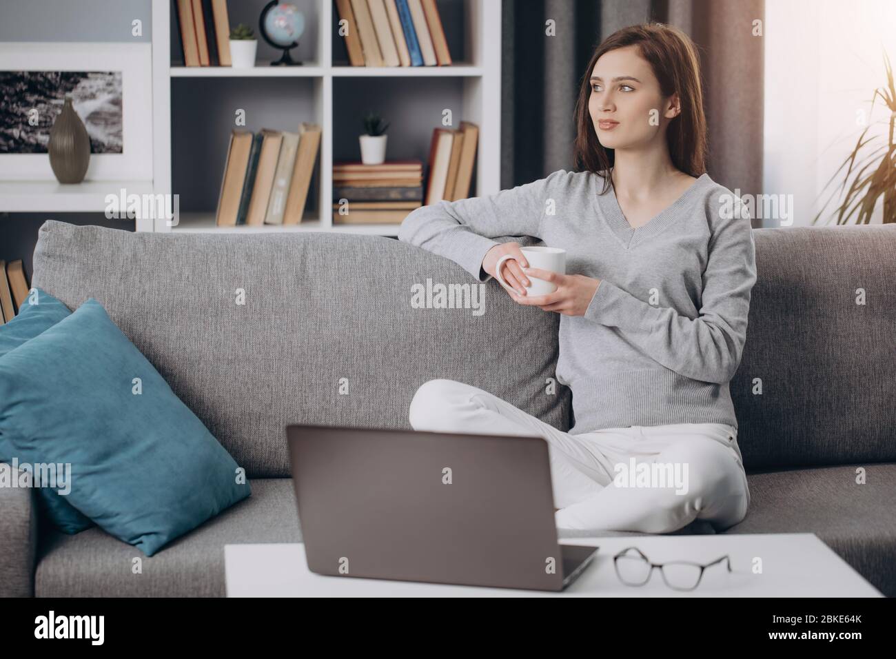 Pretty brunette relaxing on couch hi-res stock photography and images ...