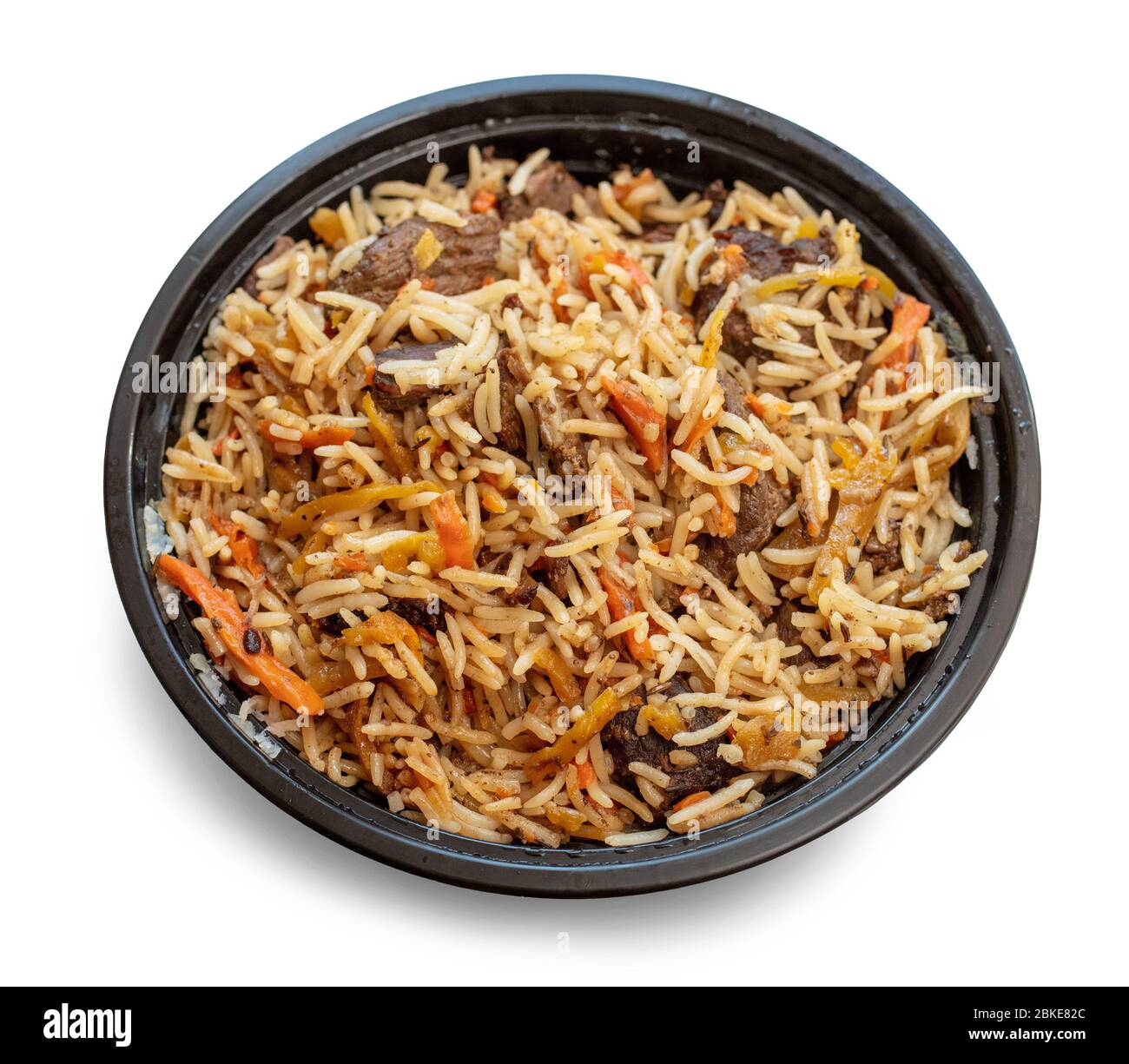 Uzbek national dish pilaf in plastic take away container isolated on ...