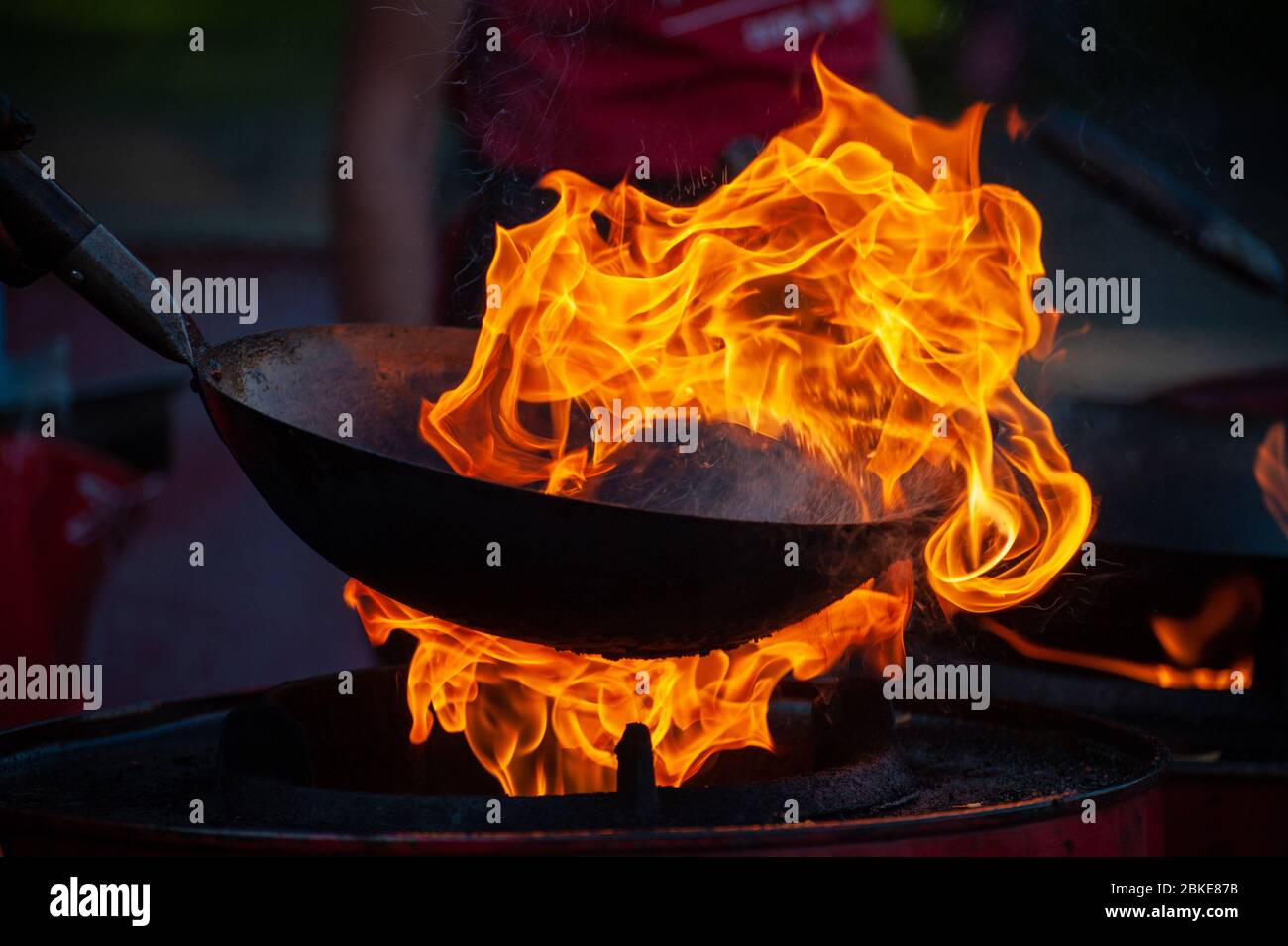 Cooking street food on a hot frying pan. Street food festival Stock ...