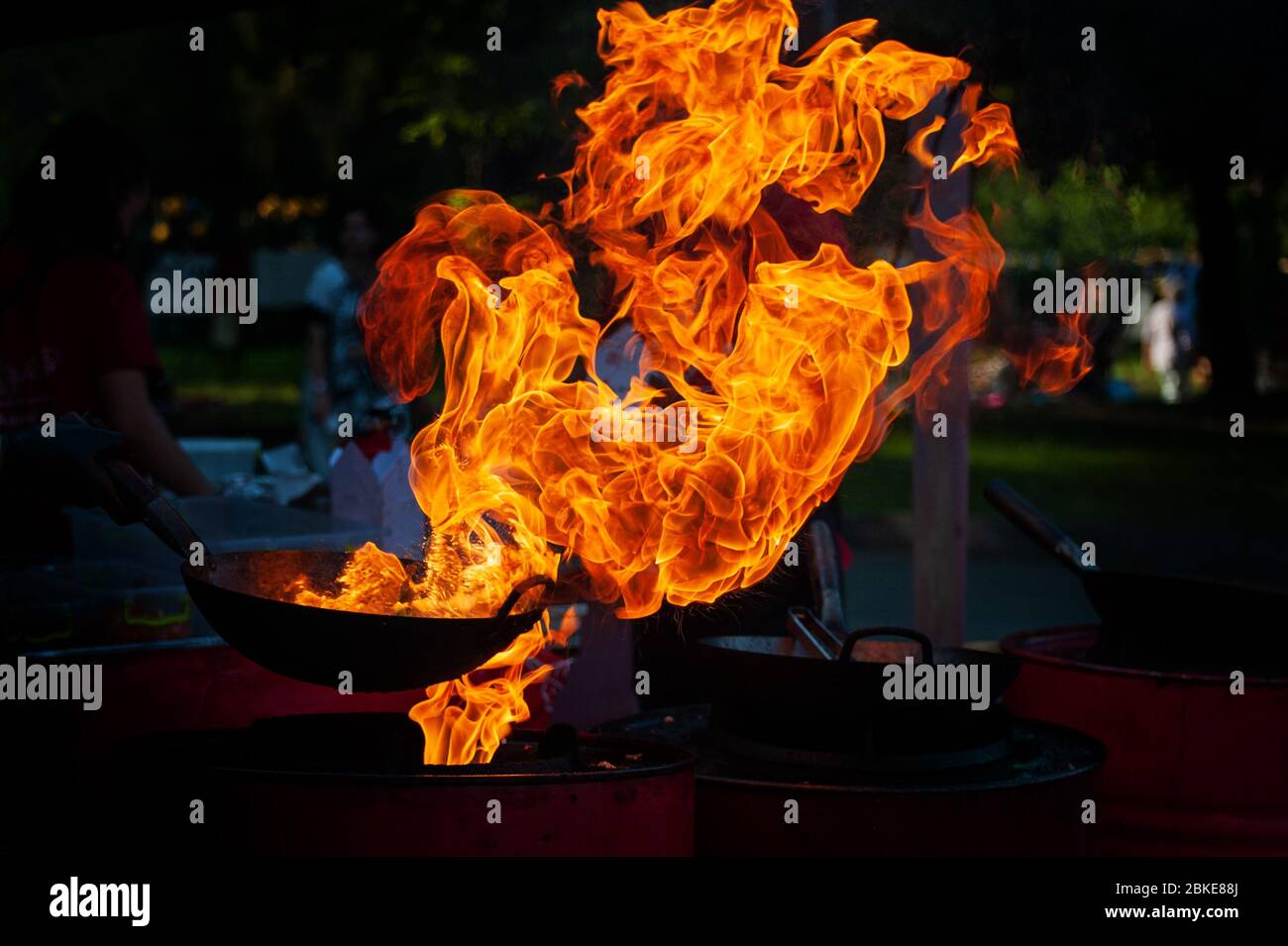 Cooking street food on a hot frying pan. Street food festival Stock ...