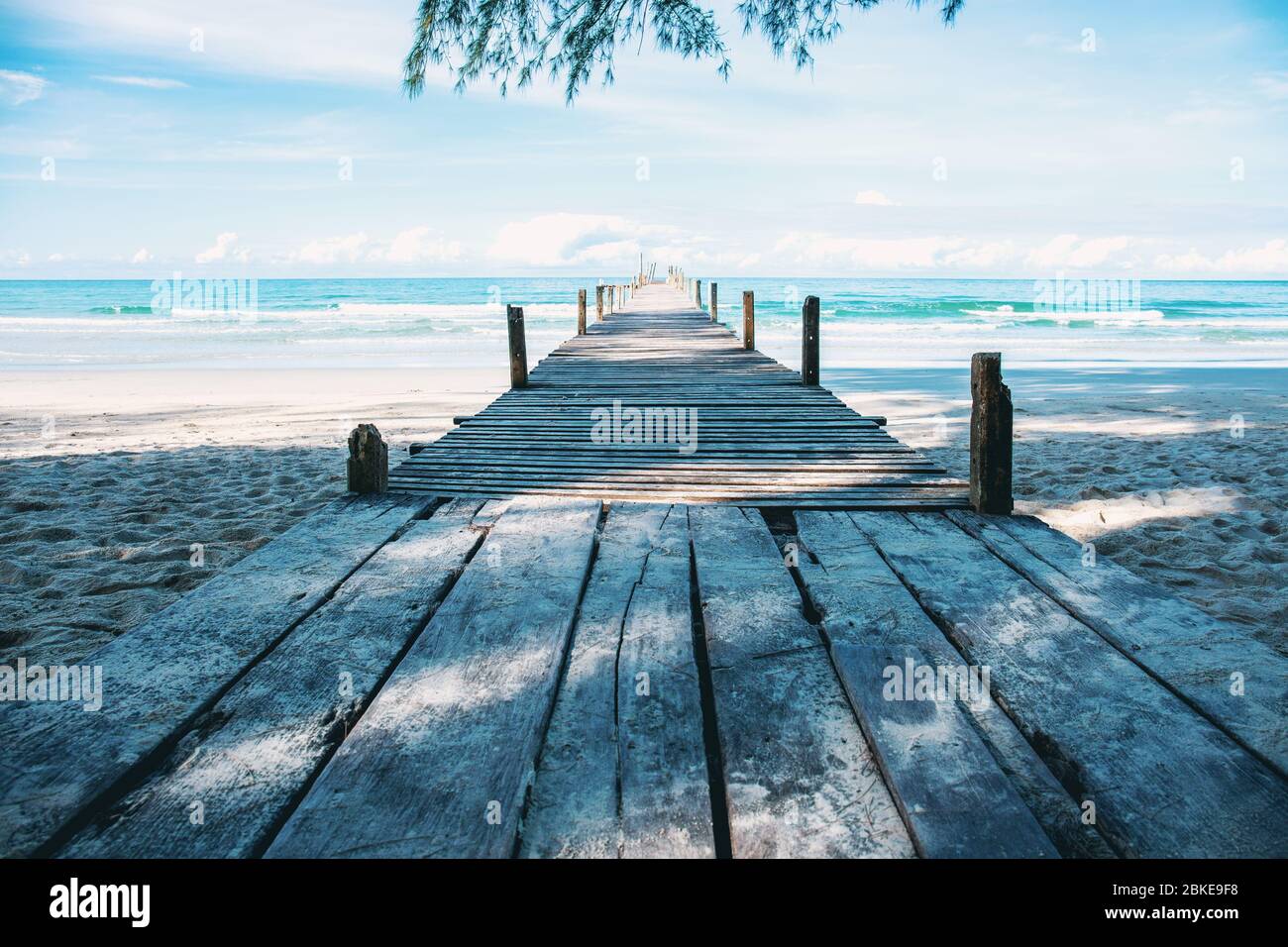 Old wooden bridge on the beach with sunlight Stock Photo - Alamy