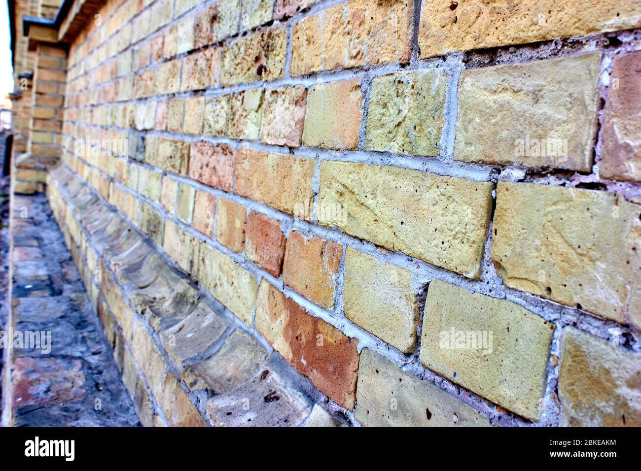 Old yellow brick wall in the old town Stock Photo - Alamy