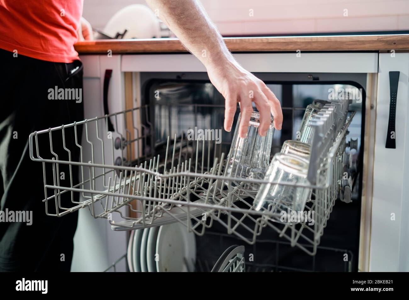 Loading a dishwasher hi-res stock photography and images - Alamy
