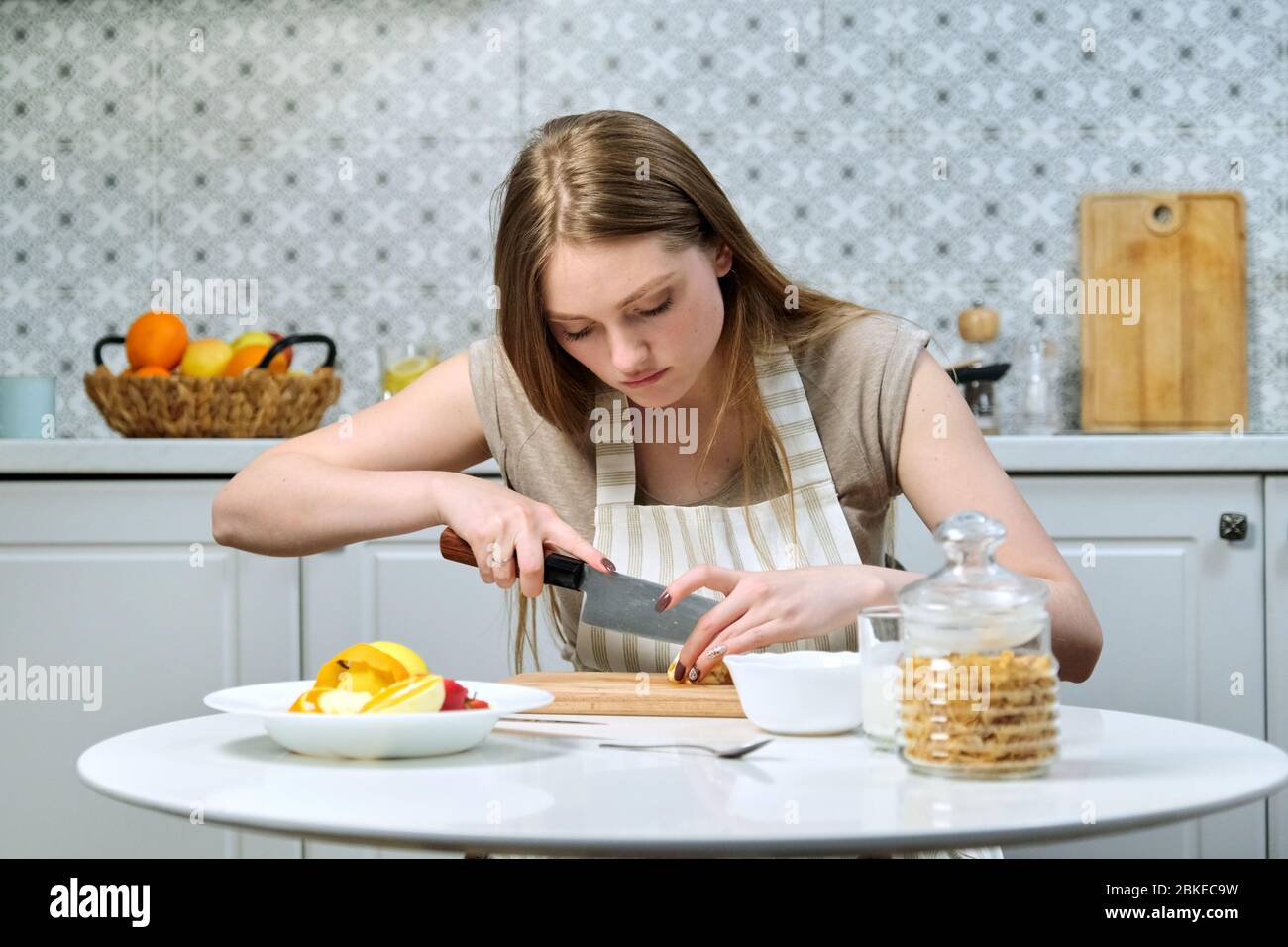 Female food blogger cooking fruit salad on camera Stock Photo - Alamy