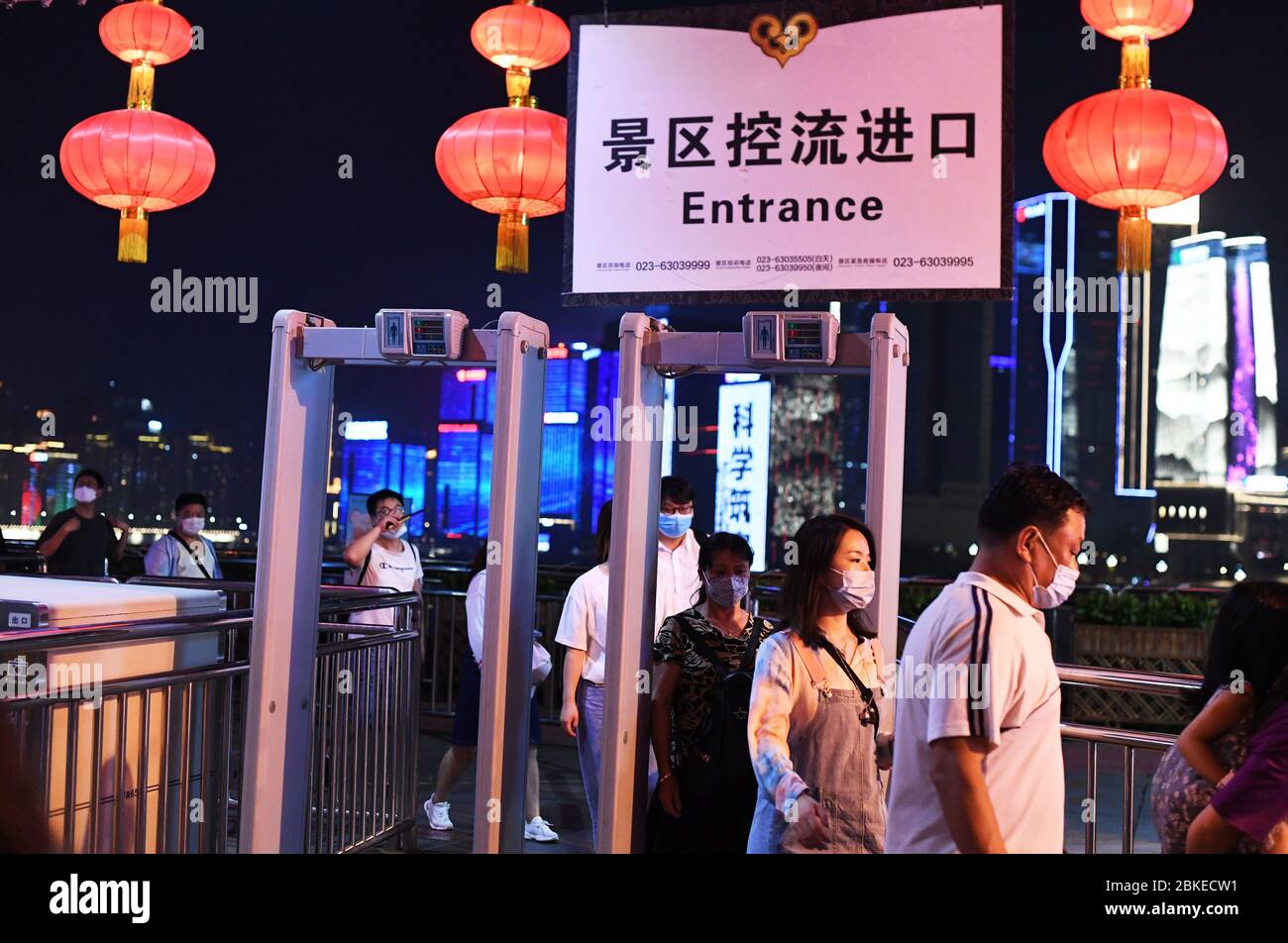 Chongqing. 3rd May, 2020. Tourists enter the Hongyadong scenic area in ...