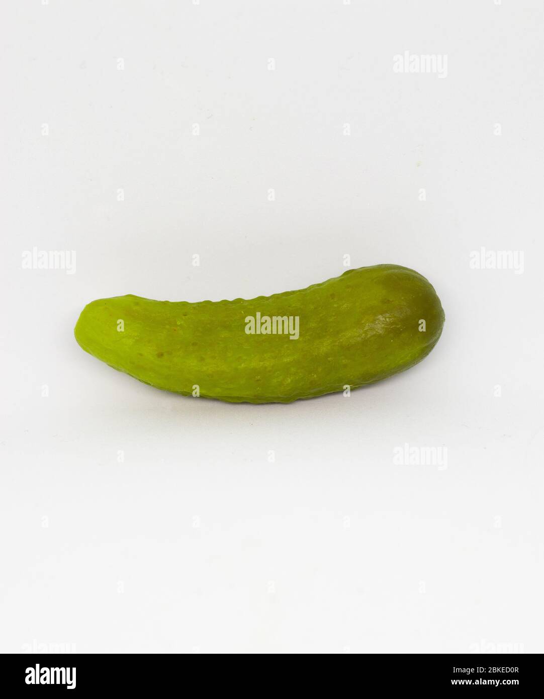Green pickle on white background isolated Stock Photo - Alamy