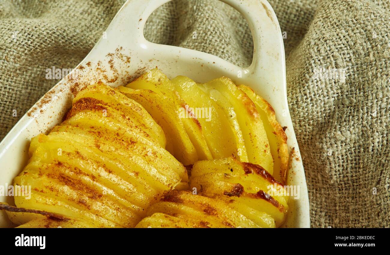 Crispy Leaf Potatoes -Best Roasted Potatoes Ever, sliced potatoes in a ...