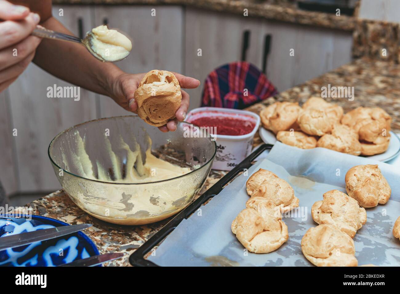 Process of cooking custard cakes by woman at domestic kitchen Stock ...