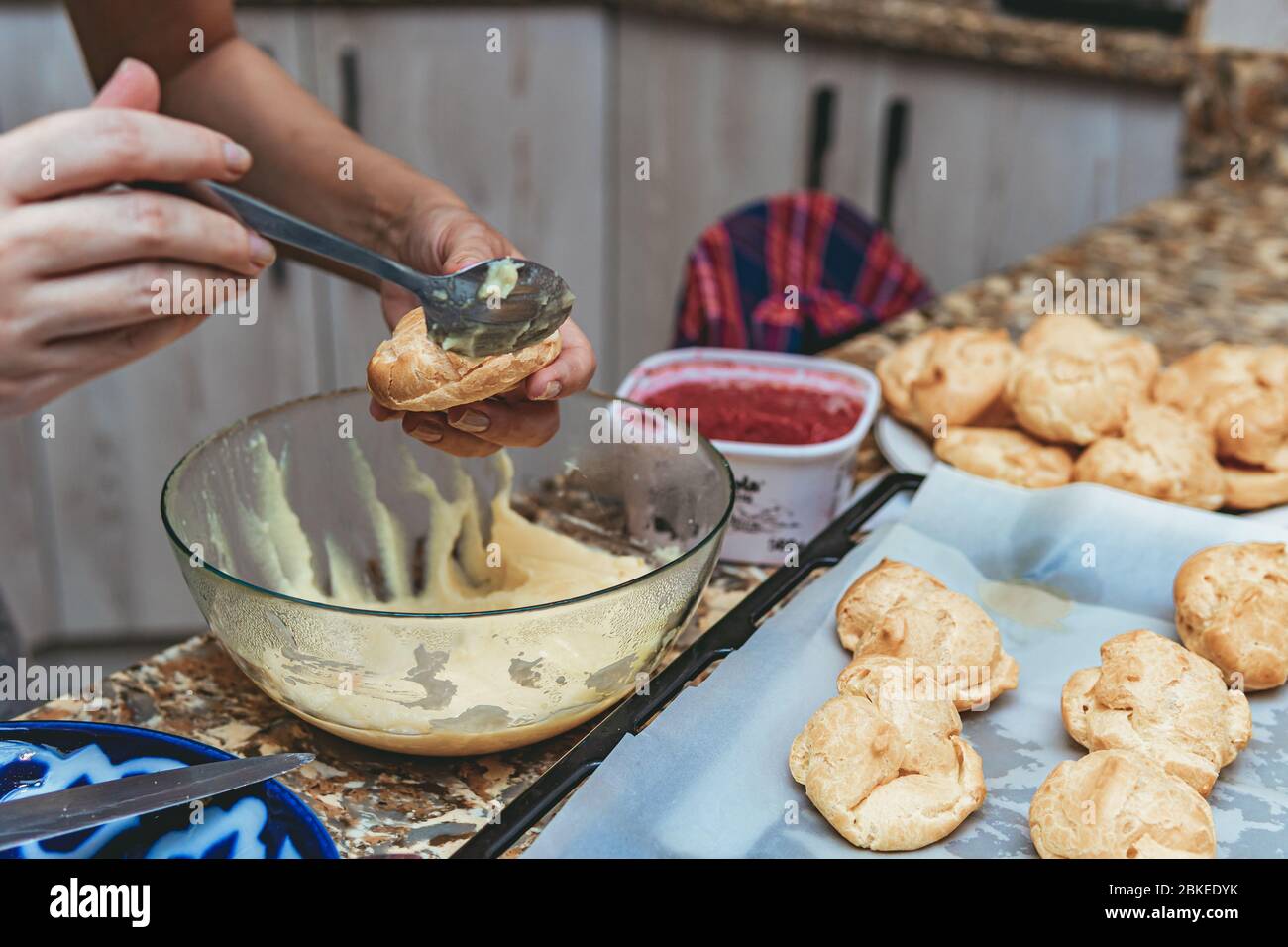 Process of cooking custard cakes by woman at domestic kitchen Stock ...