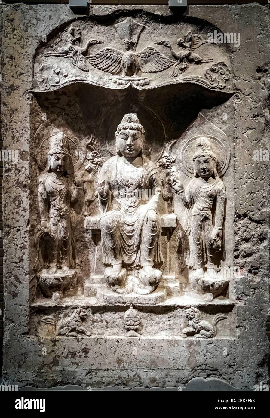 Buddha triad in a niche, carving on limestone from Baoqingsi temple, Xi ...