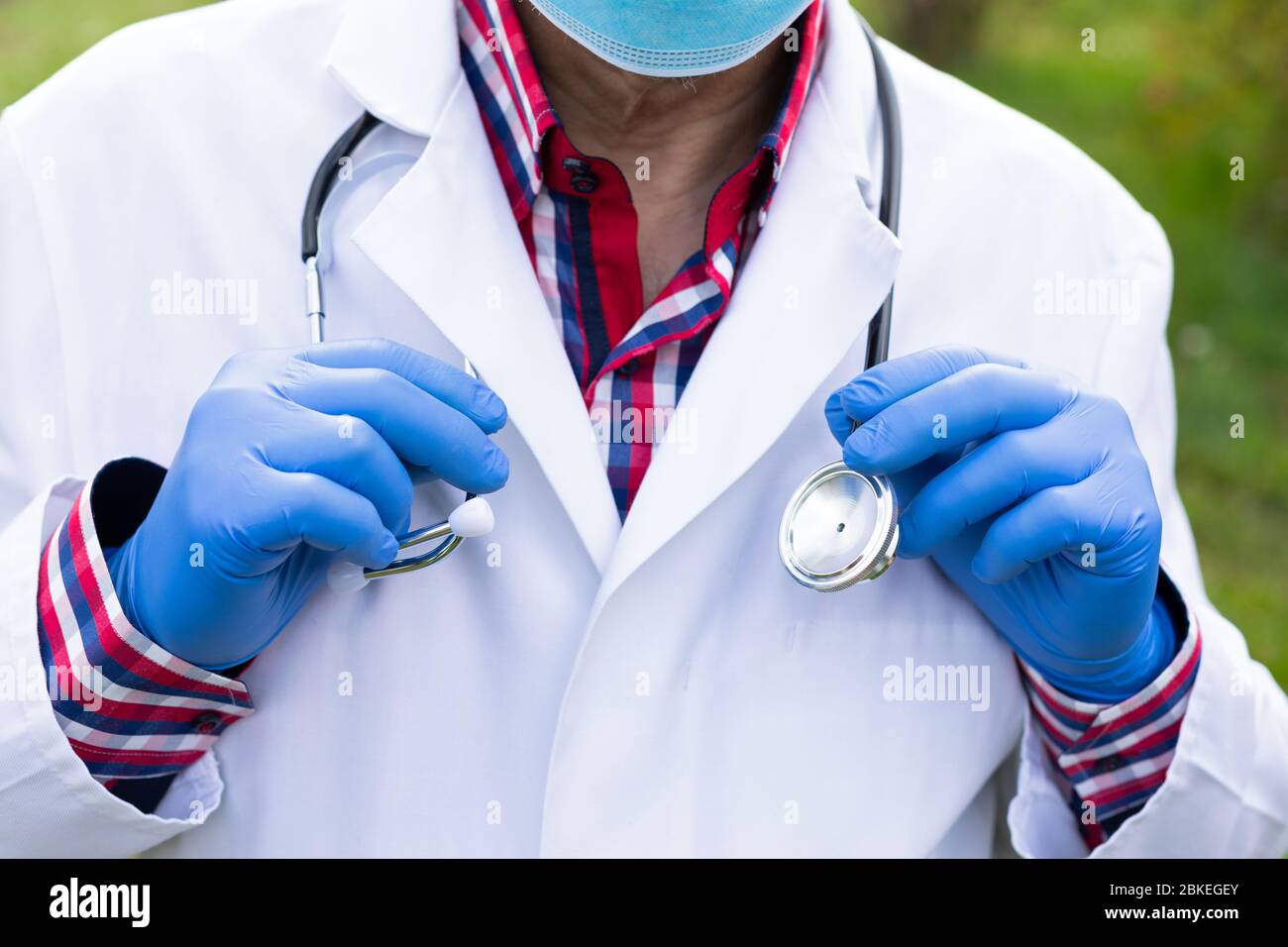 Close up picture of senior male doctor's hand with gloves in front of ...