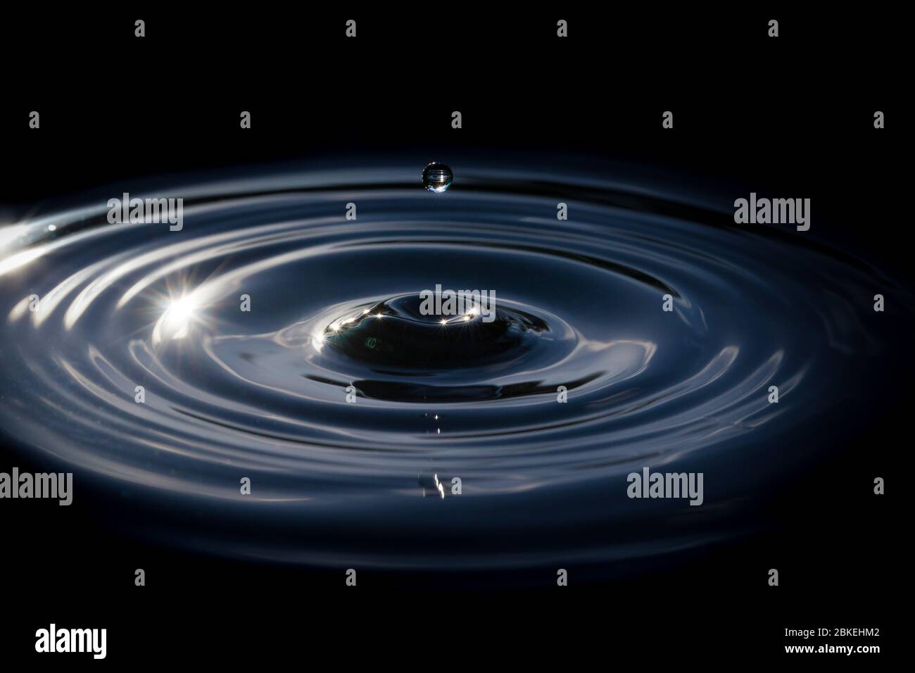 Water Drop splash with sun Stock Photo - Alamy