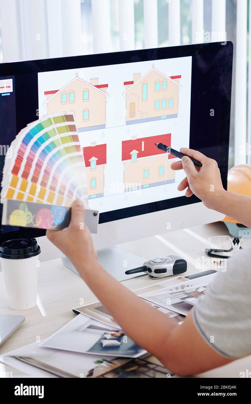 Designer holding palette when choosing color scheme for new house and ...