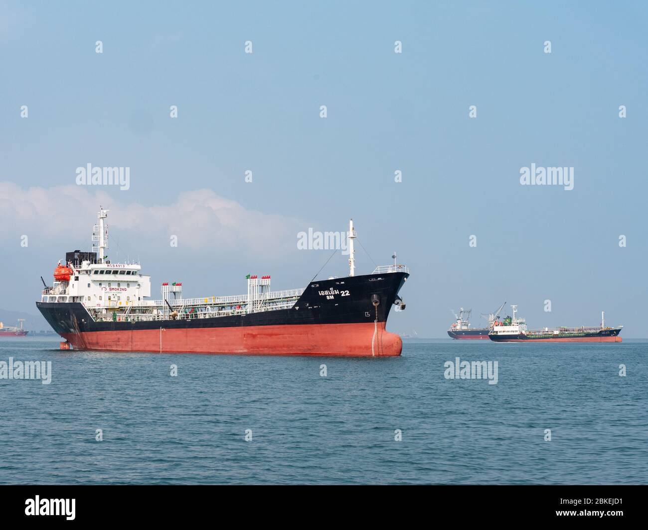 Small oil tanker moored between the City of Siracha and Koh Sichang, at ...