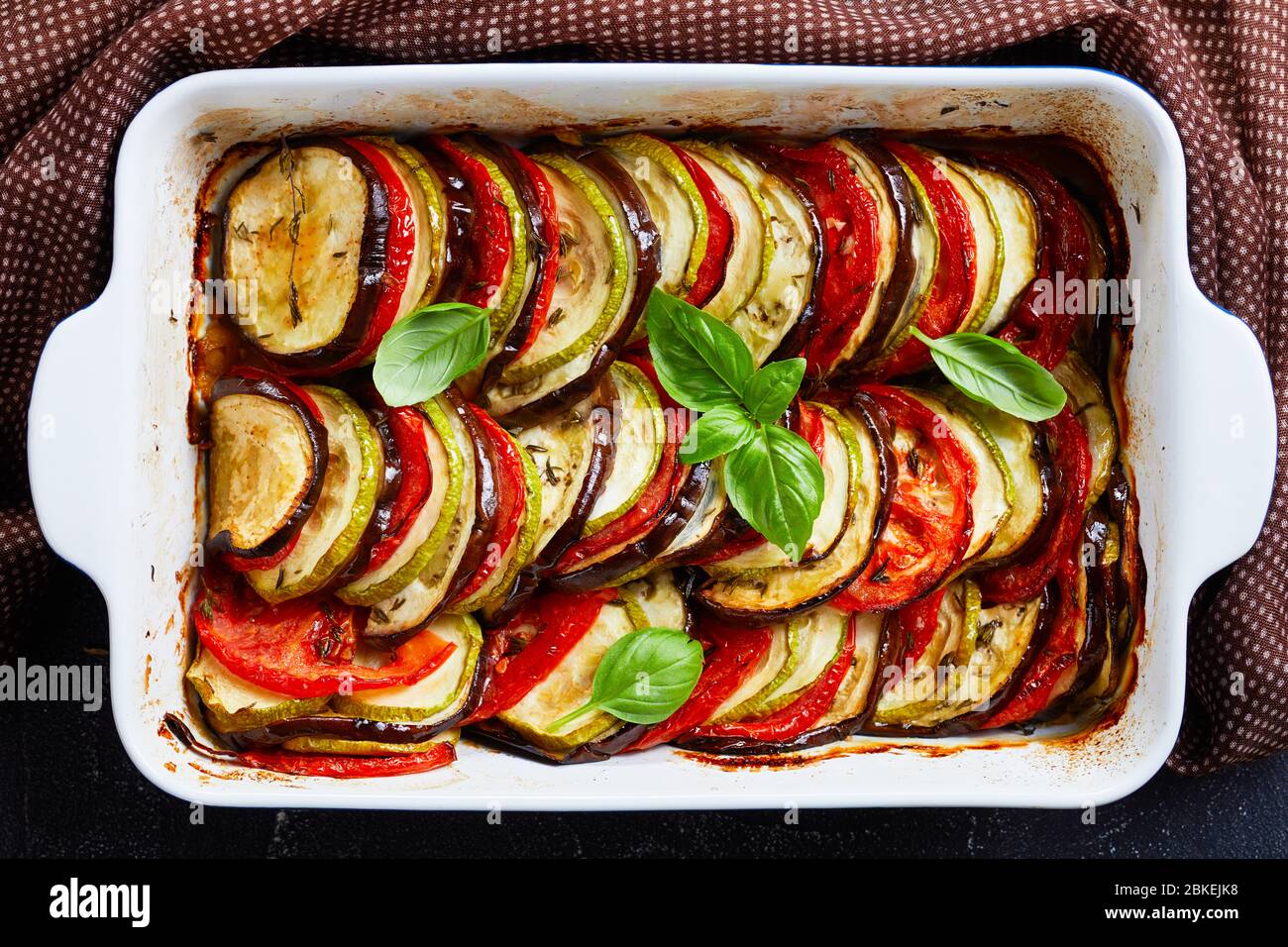 tian provencal, baked vegetable side dish in a baking dish, horizontal ...