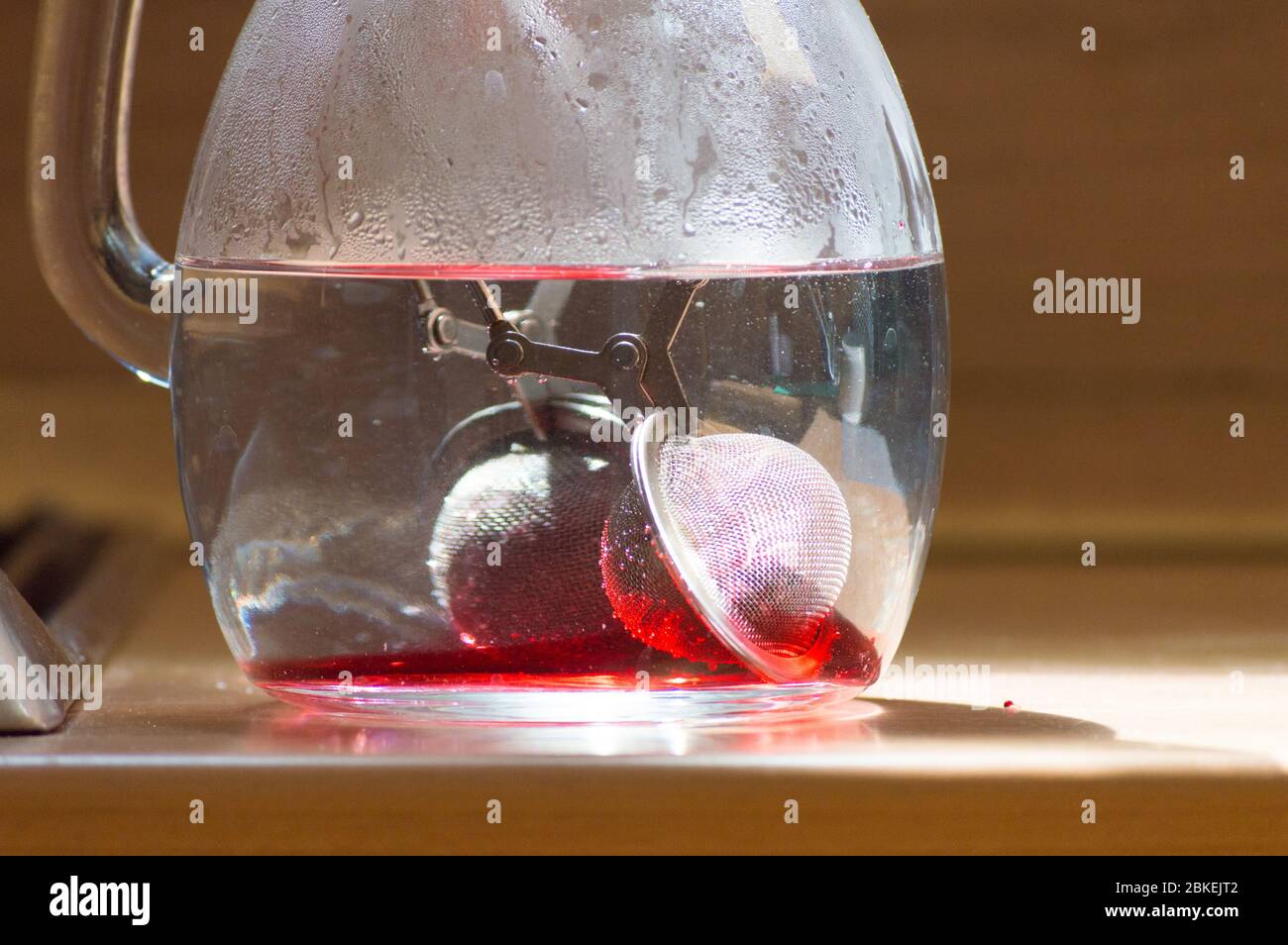 A large pitcher of hibiscus flowers in infusion Stock Photo - Alamy