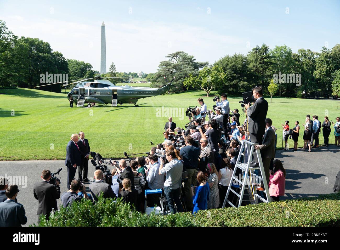 President Donald J. Trump, accompanied by Secretary of Labor Alex ...