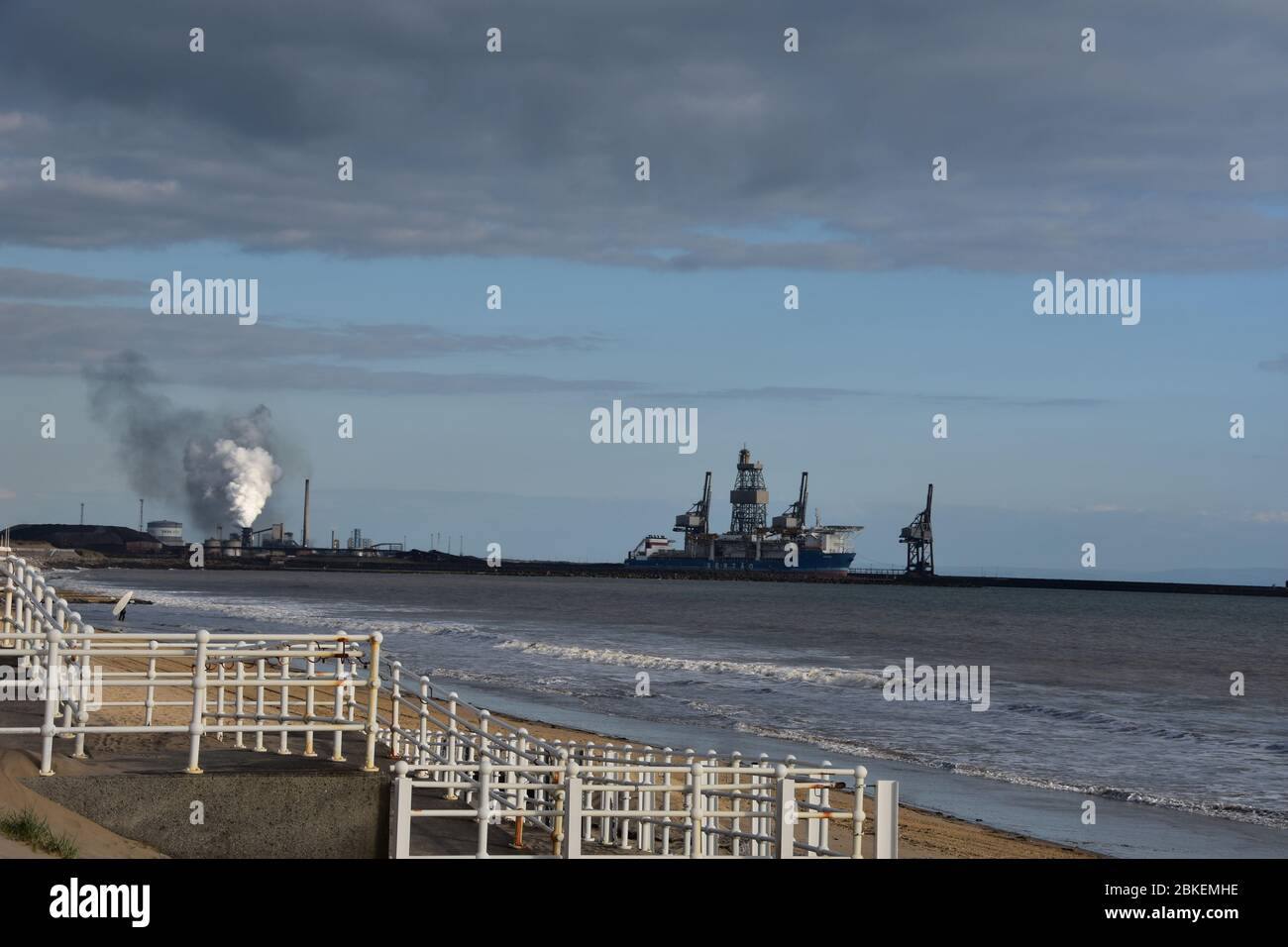 A landscape photograph of Port Talbot beach, with the steel works and ...