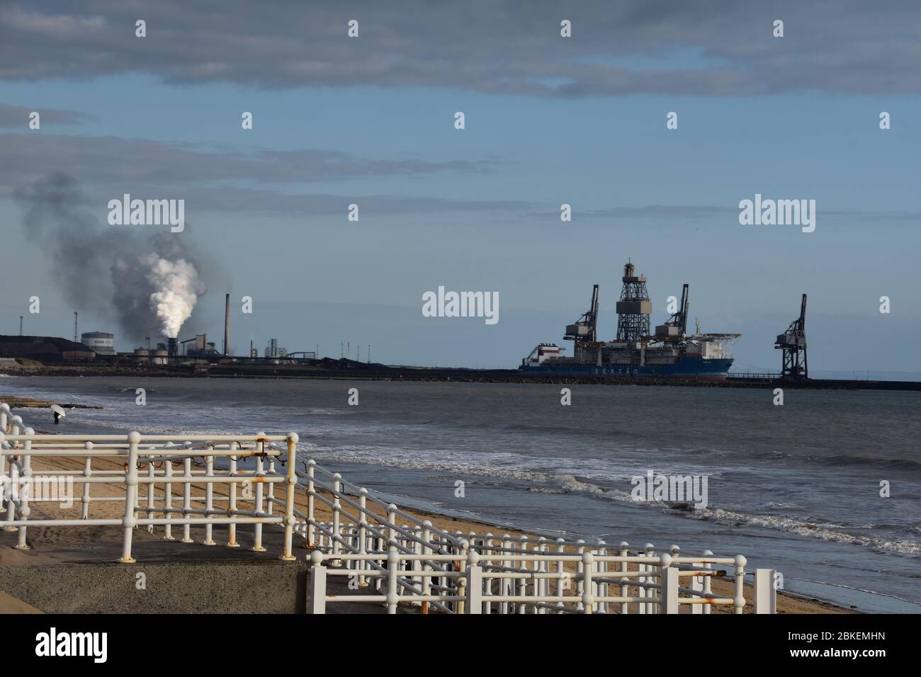 A landscape photograph of Port Talbot beach, with the steel works and ...