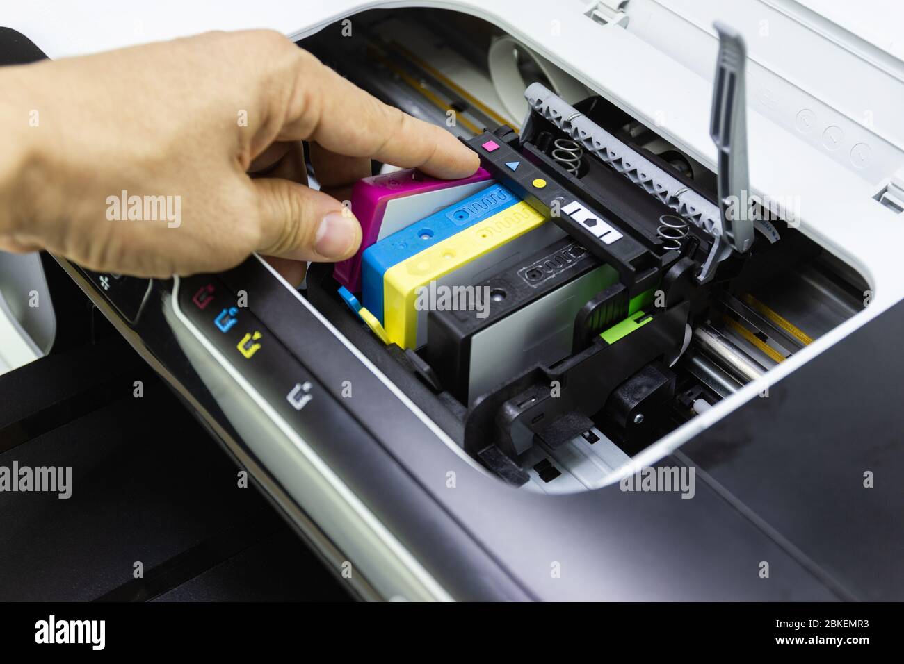 Technicians are install setup the ink cartridge of a inkjet printer the ...